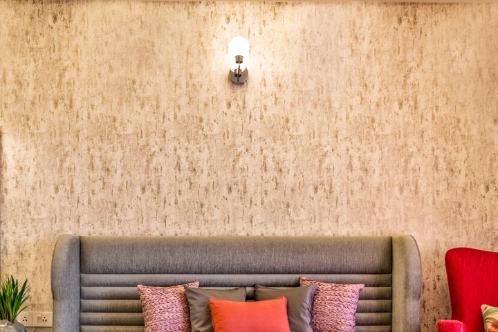 Beige Textured Bedroom Wallpaper With Wall Sconce | Livspace