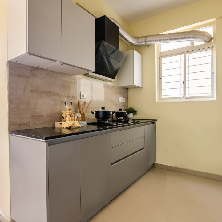 Kitchen Window Design With Grills And Exhaust Fan Outlet | Livspace