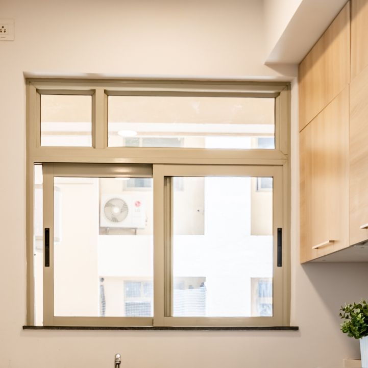 Kitchen Window Design With A Beige UPVC Frame | Livspace
