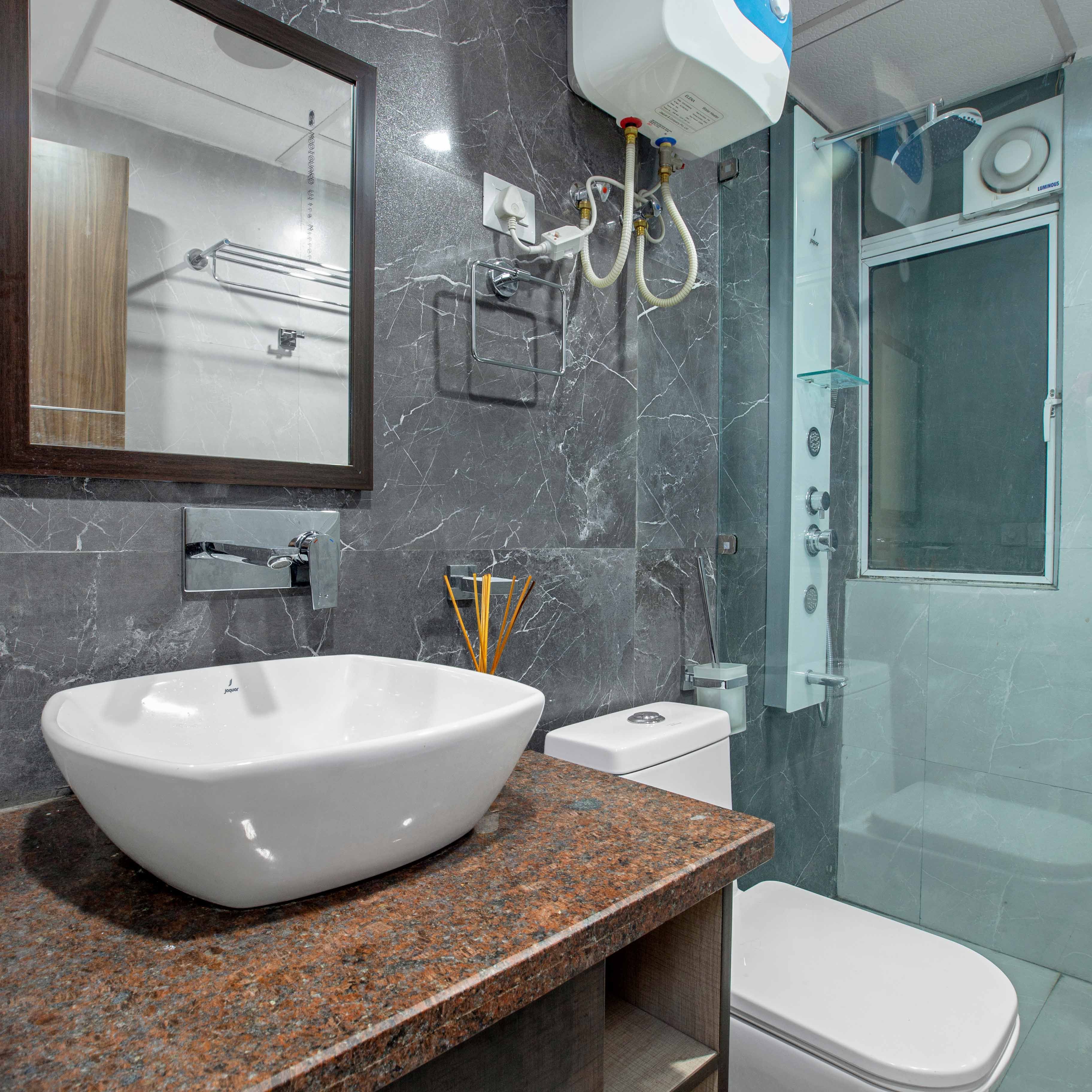 Well-Lit Bathroom Design With A Shower Area | Livspace