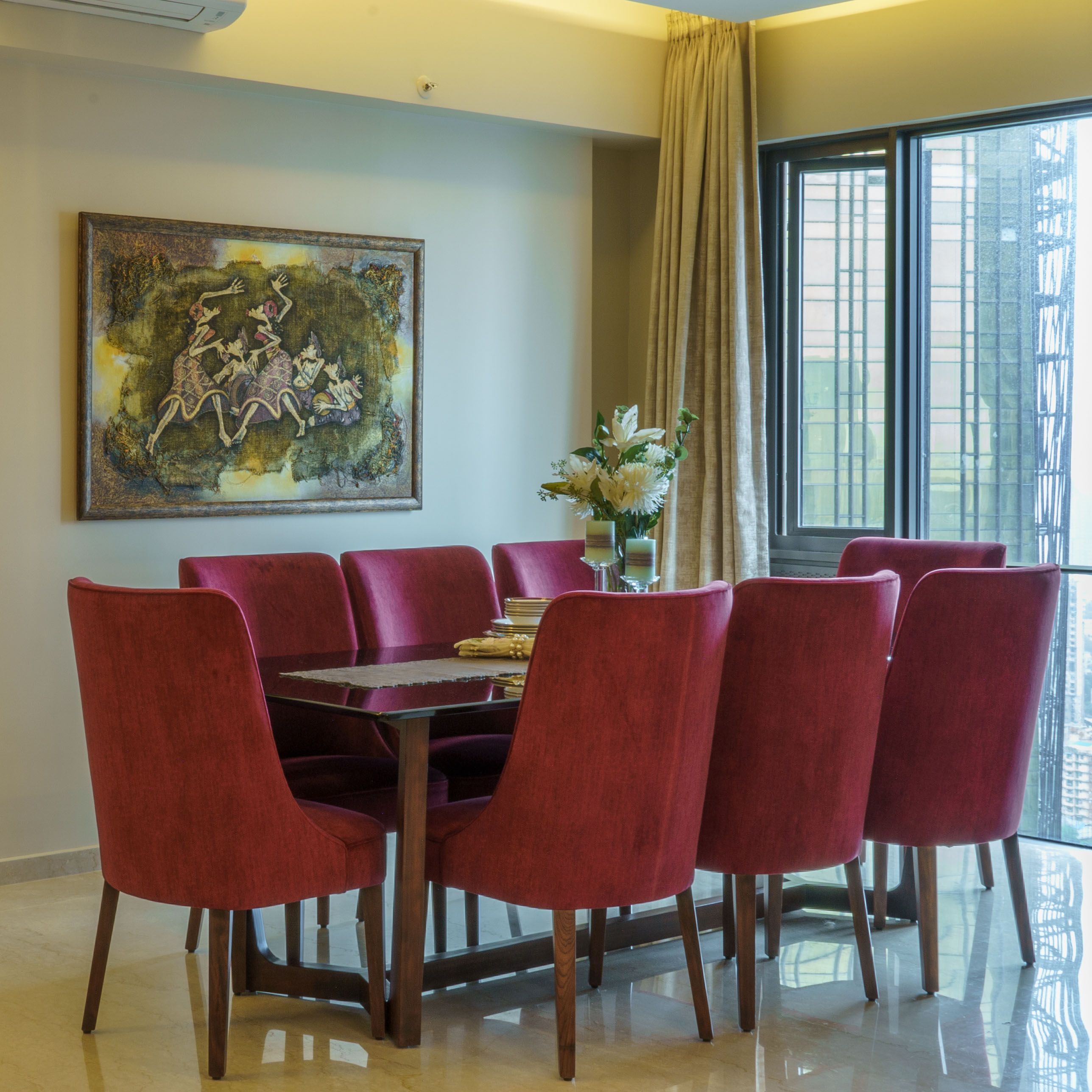 Spacious 8-Seater Dining Room Design With Pink Upholstery | Livspace