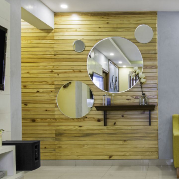 Spacious Foyer Design With Wooden Accent Wall And Mirrors | Livspace