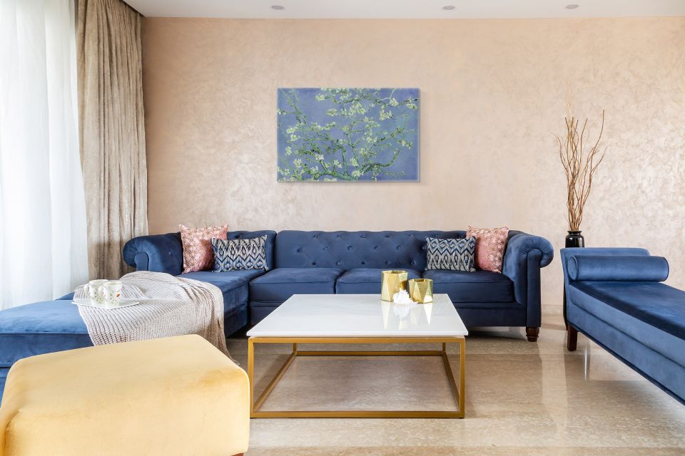Compact Living Room Decor With Seating And Foot Stool | Livspace