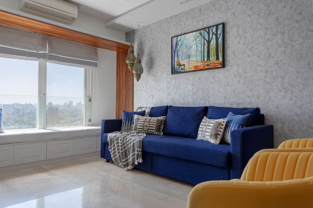 Spacious Drawing Room Design With Yellow Accent Chairs | Livspace