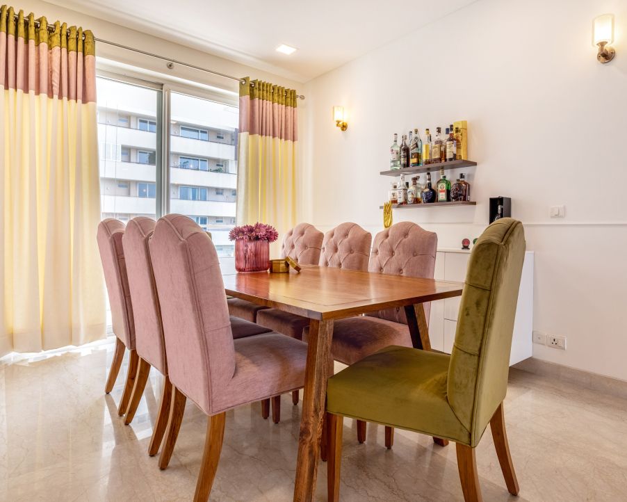 Spacious Dining Hall Design With A Wooden Table | Livspace