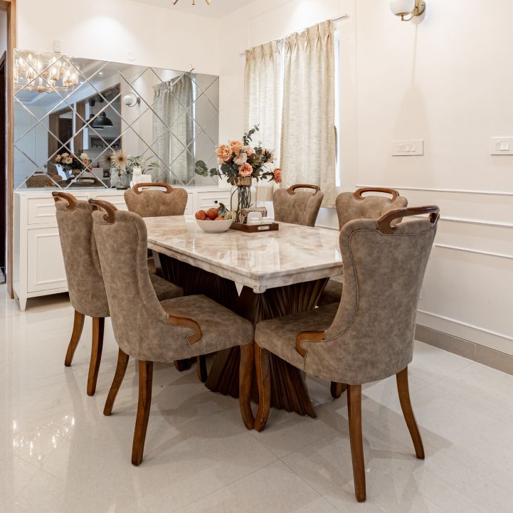 Dining Room Design With Light Grey Upholstered Chairs | Livspace