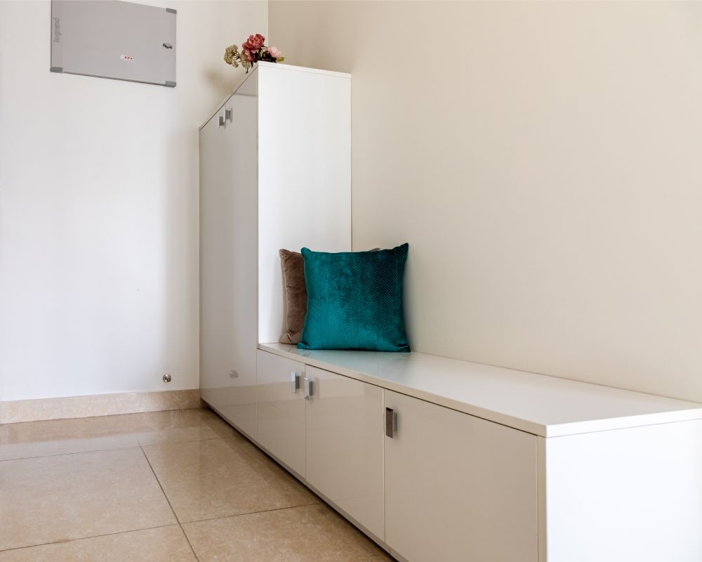 Spacious Foyer Design With Closed Storage | Livspace
