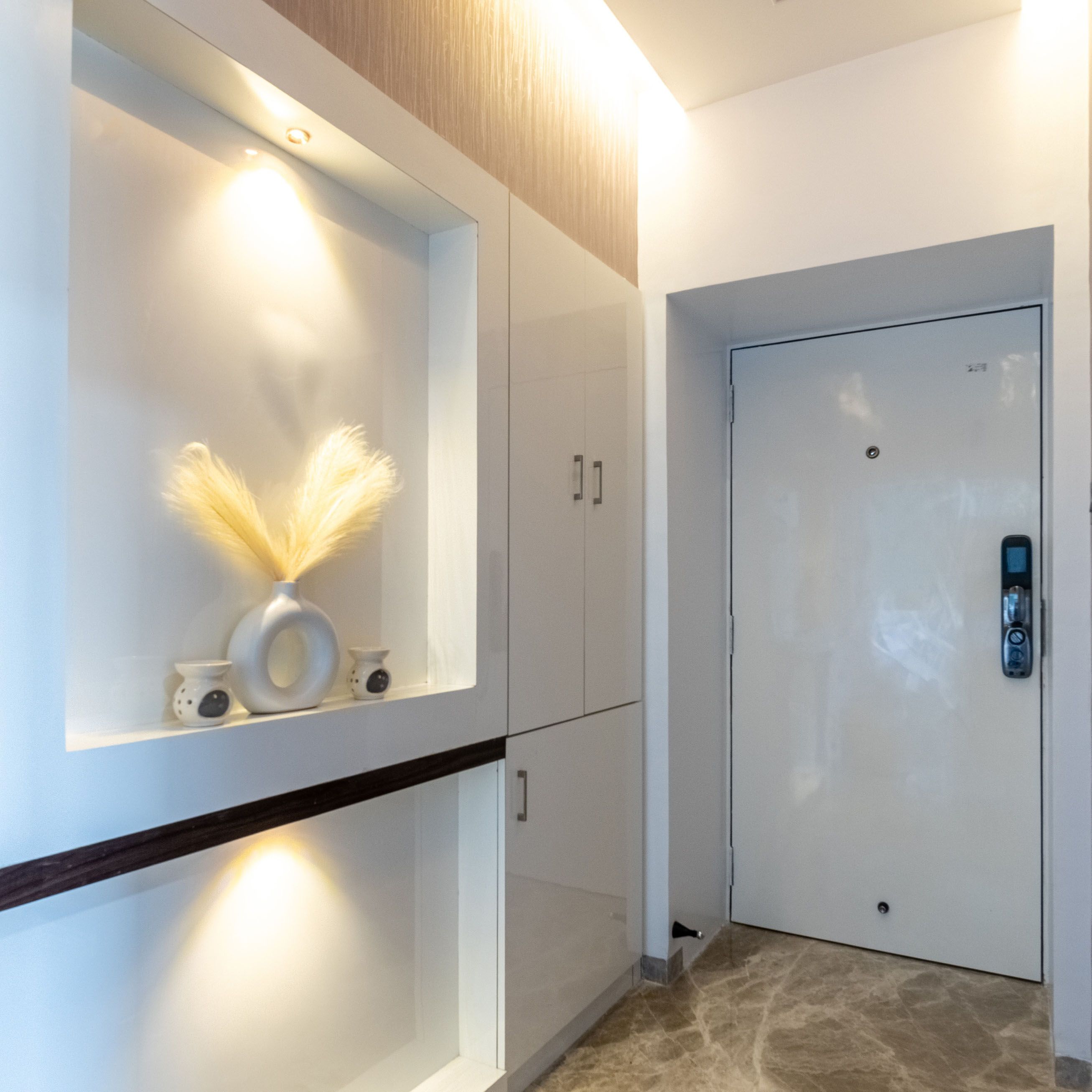 Frosty White Foyer Design With Marble Flooring | Livspace