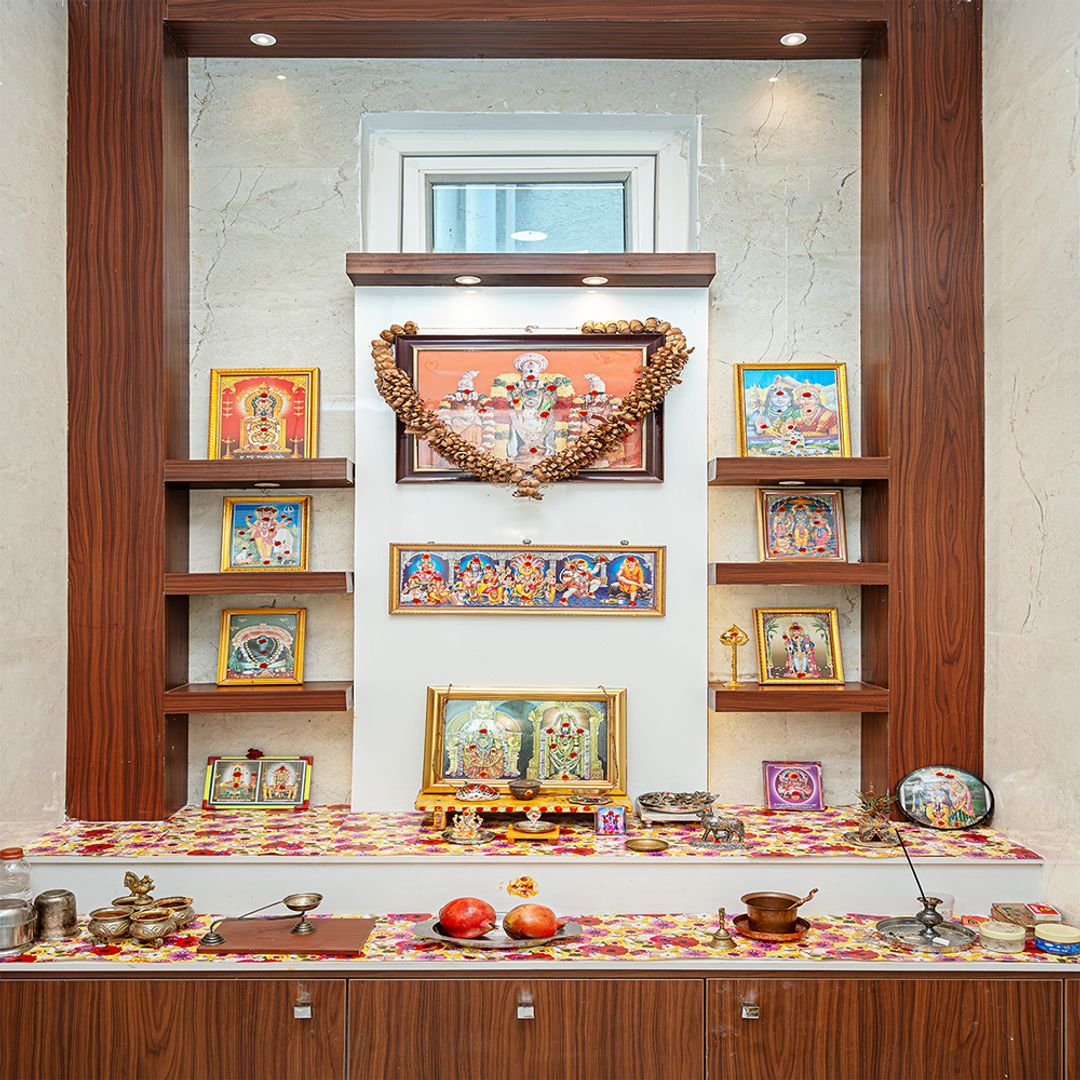 Traditional Pooja Room Design in Wood with Shelving Flanks Display for ...