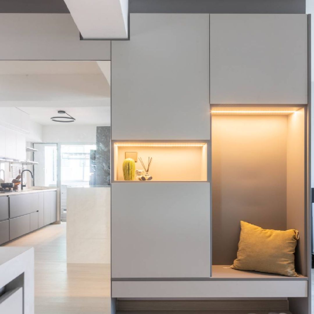 White Foyer Design With Niche Seating Area And Lights | Livspace