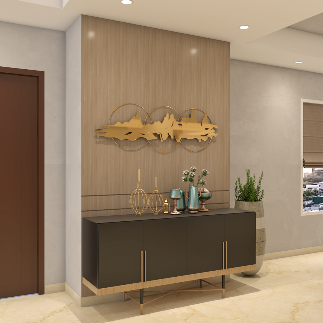 Classic Foyer Design With Golden Accessories And Storage Unit | Livspace