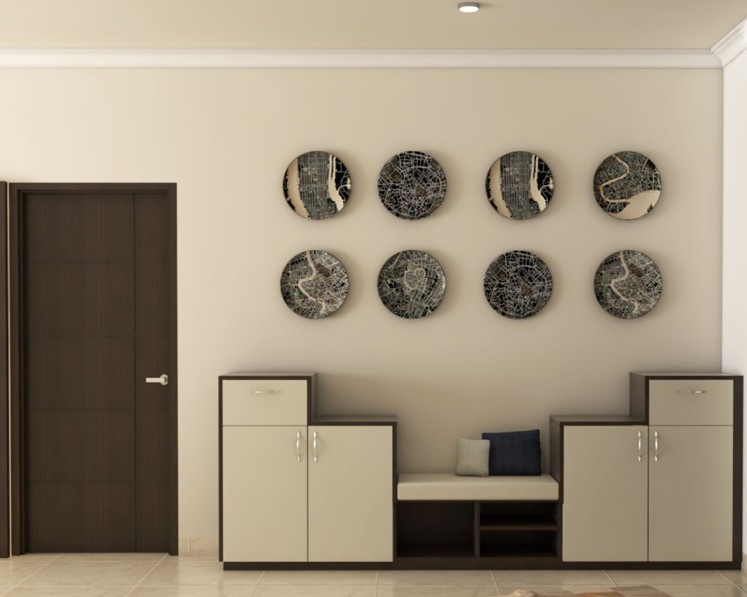 Champagne-Toned Foyer Design With Stepped Storage Unit And Plated Wall ...