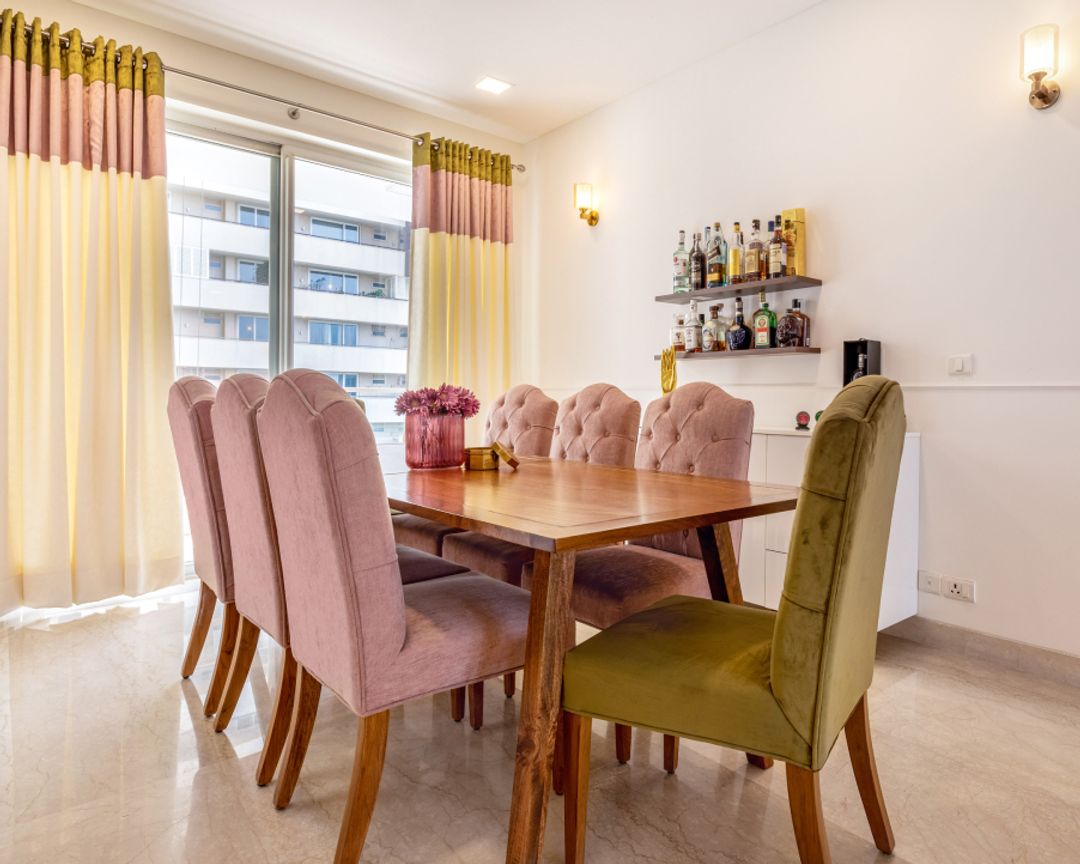 Spacious Dining Hall Design With A Wooden Table | Livspace