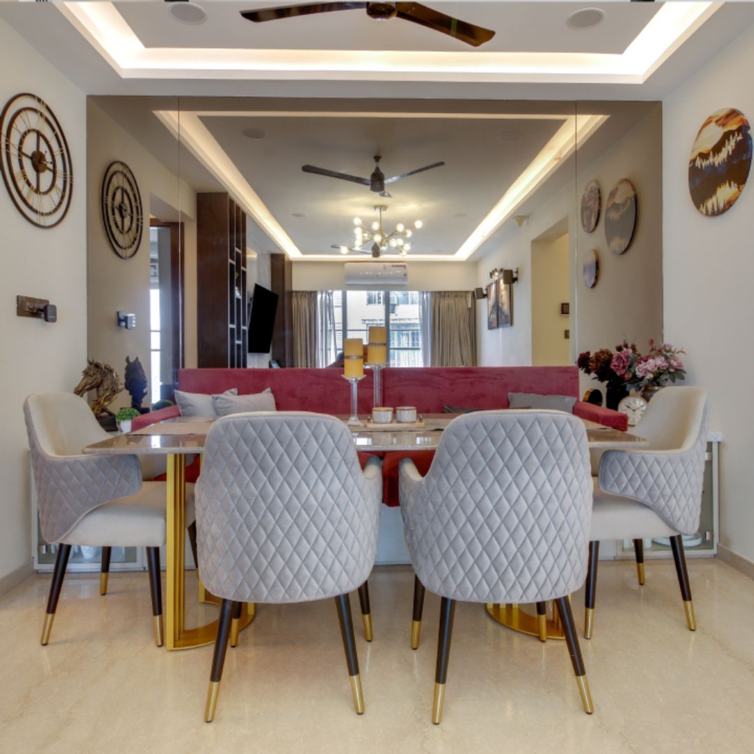 Spacious Dining Room With Grey Chairs And A Maroon Bench | Livspace