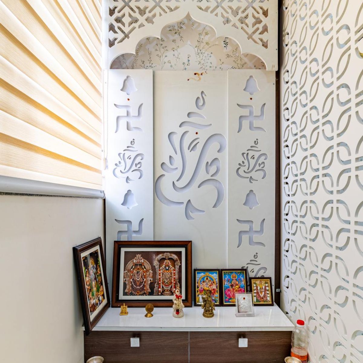 Compact Pooja Mandir Design With White Wall Panels And A CNC Design ...