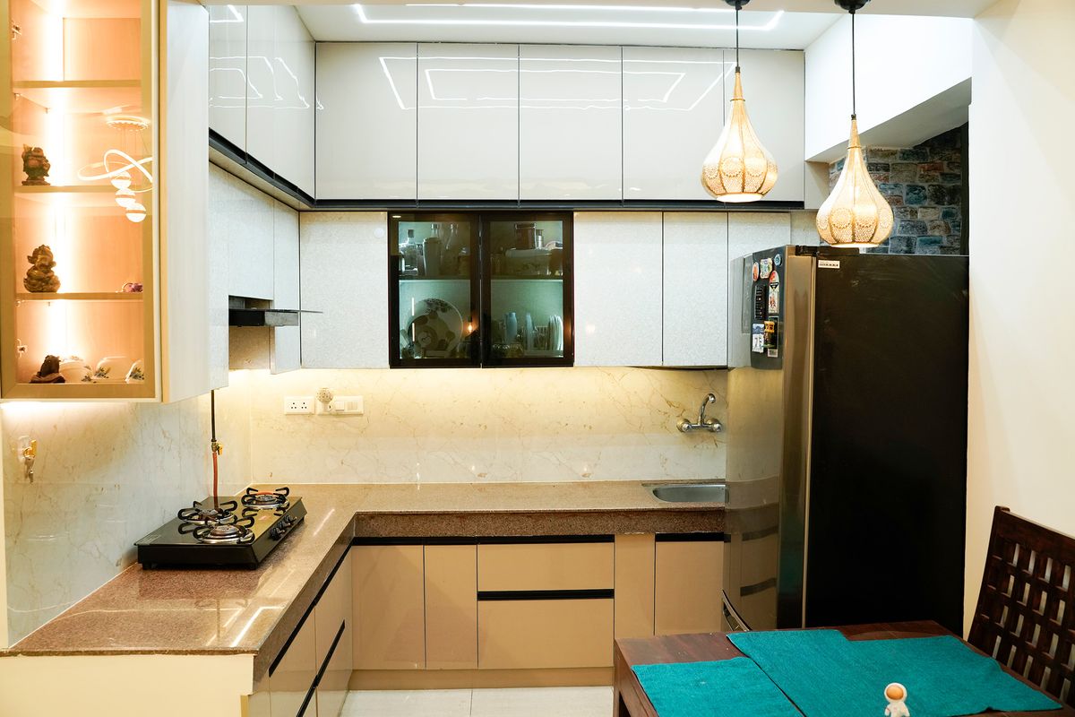 Modern L-Shaped Kitchen Design with Warm Lighting and Granite ...