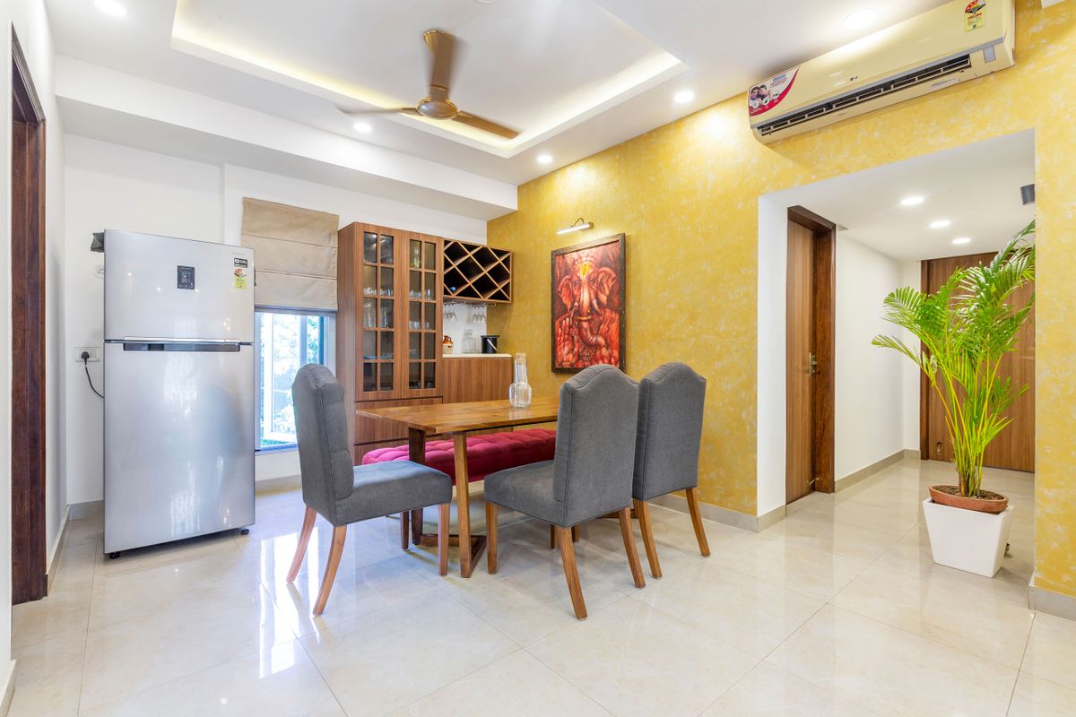 Spacious Dining Room Design With A Bar Unit | Livspace