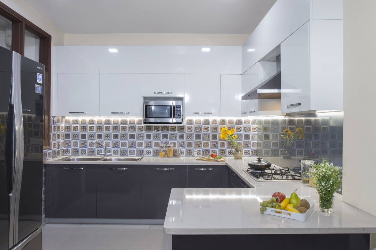 Modern 3BHK Noida Flat Interior Design with Peninsula Kitchen and ...