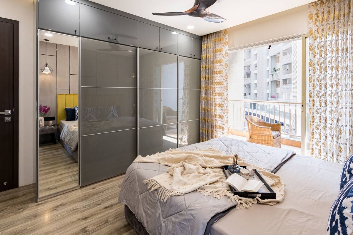 3BHK Pune Flat Modern Design with L-Shaped Kitchen and Cove Lighting | Livspace