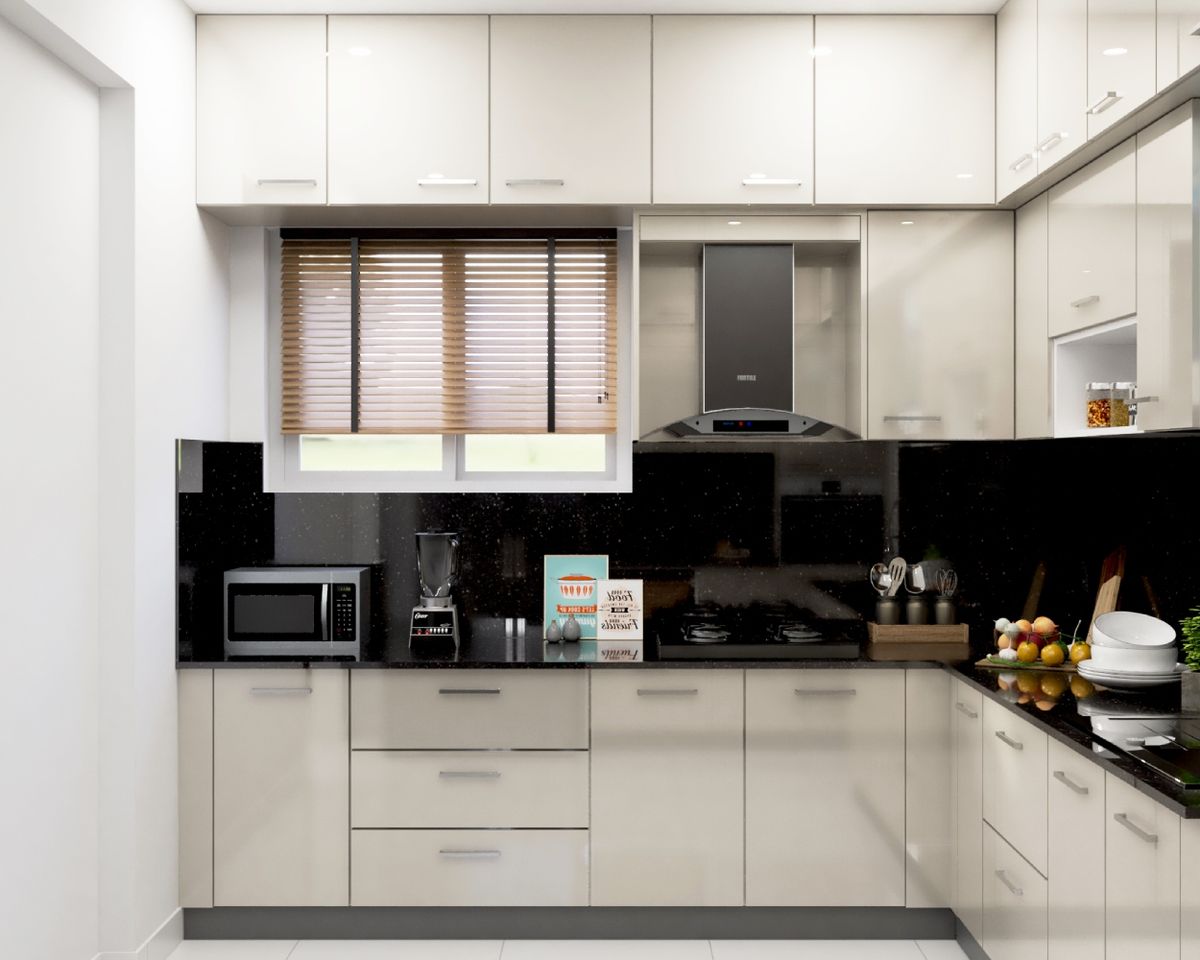 Spacious Modern L-Shape Kitchen Design with Champagne Finish | Livspace