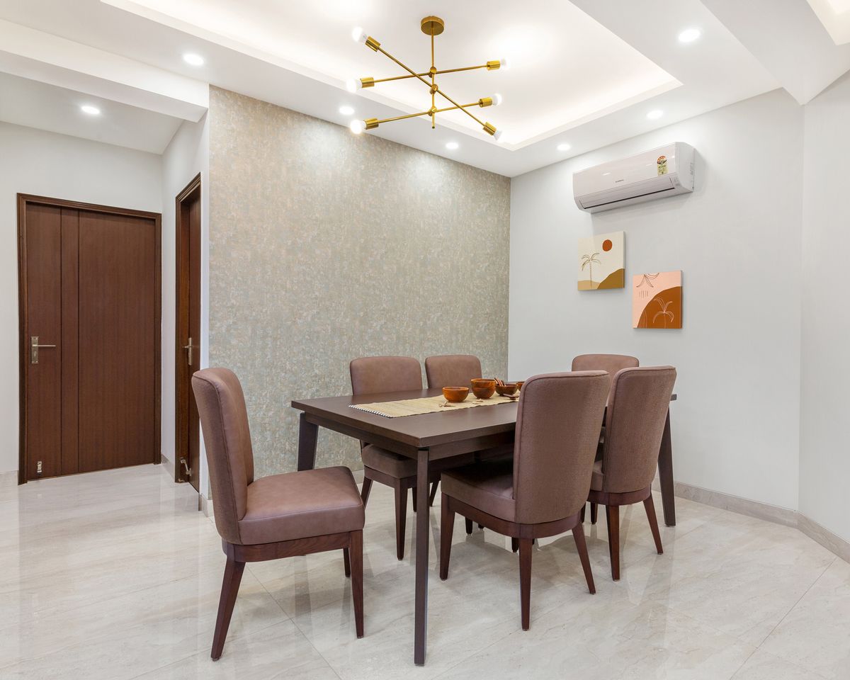 6-Seater Dark Brown Dining Room Design With Grey Textured Wall | Livspace