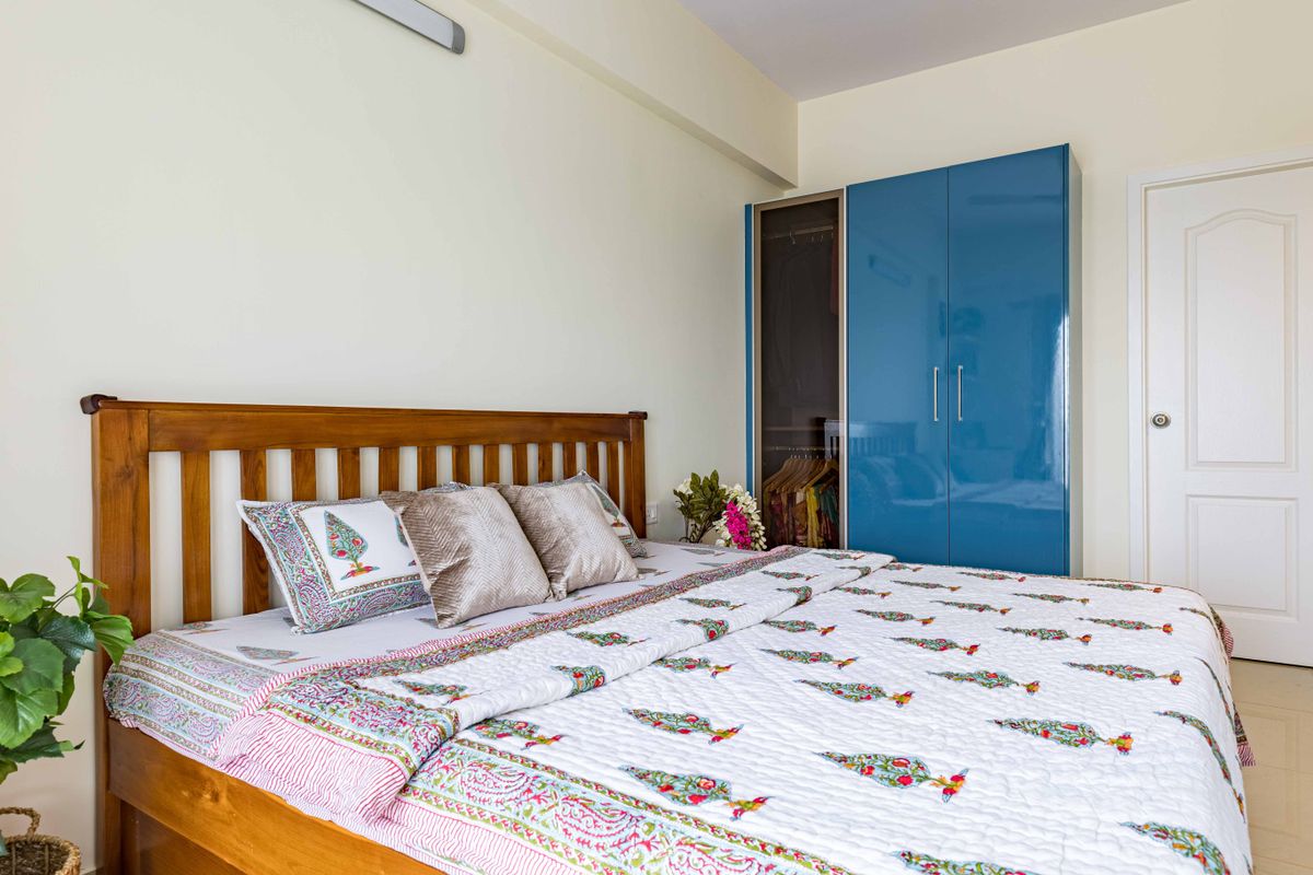 2-BHK Contemporary Bangalore Flat With Glossy Blue And White L-Shaped Kitchen Design | Livspace