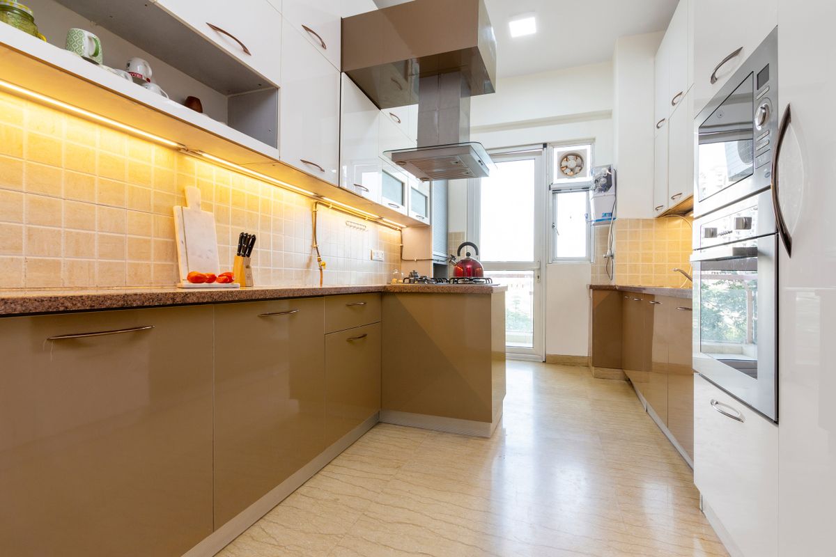 Modern Parallel Modular Kitchen Design With Tan Base and Frosty White ...