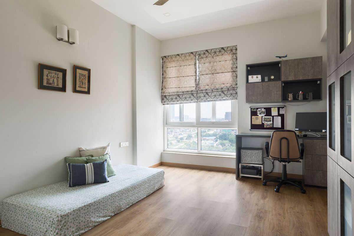 Gurgaon 2-BHK Flat Design With Yellow And White Patterned Living Room ...