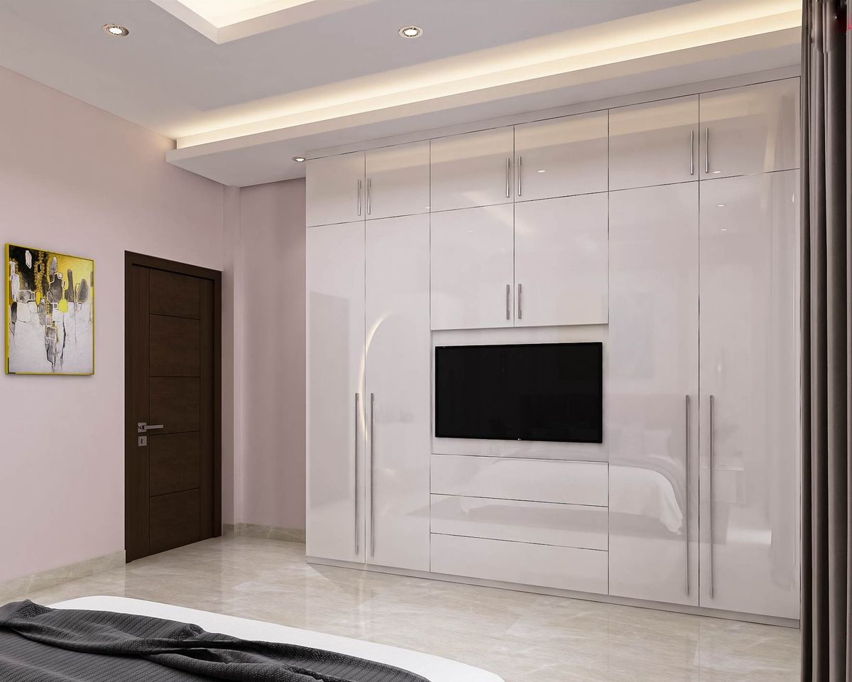 White 4-Door Wardrobe Design With An Integrated TV Unit | Livspace