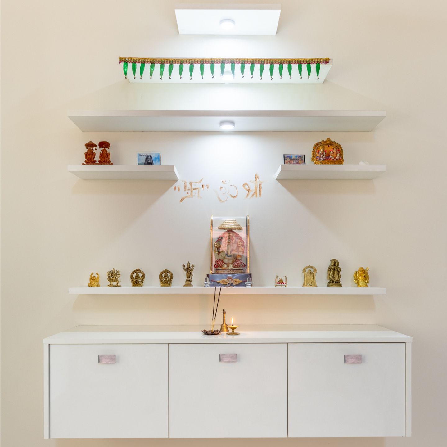 Spacious Pooja Unit Design With Wall-Mounted Open Shelves | Livspace