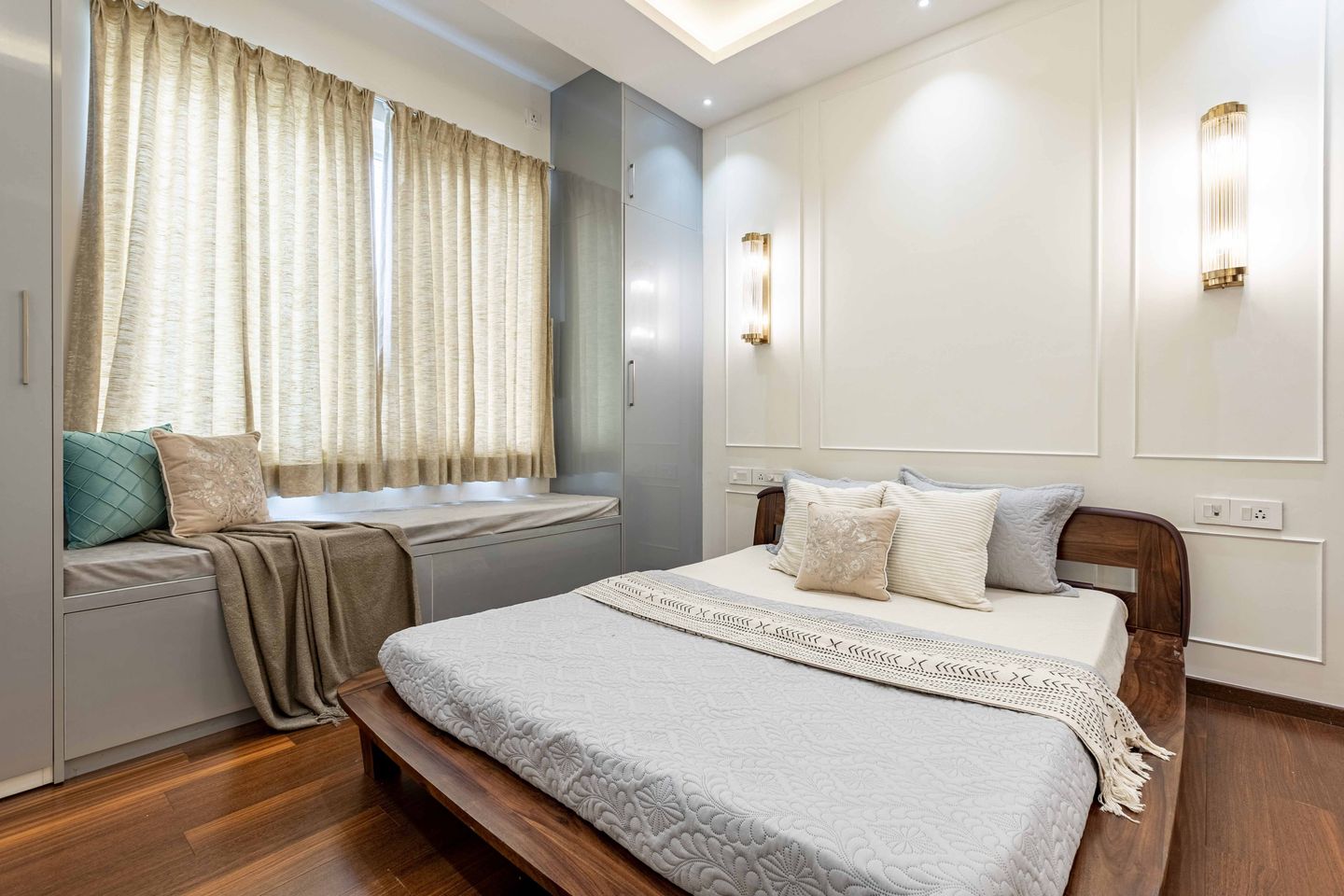 Spacious Beige Guest Room Design With Window-Seater And Wooden Bed ...