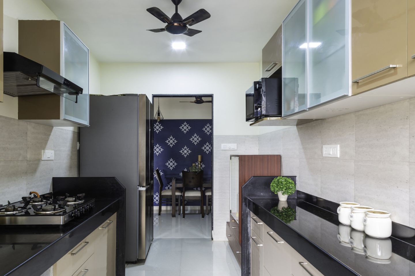 Parallel Kitchen Design With A Granite Countertop | Livspace