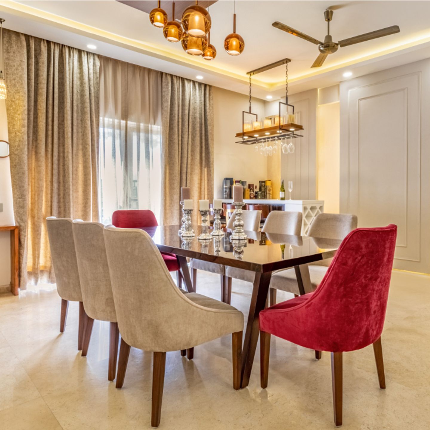 Spacious Dining Room With Red Chairs | Livspace