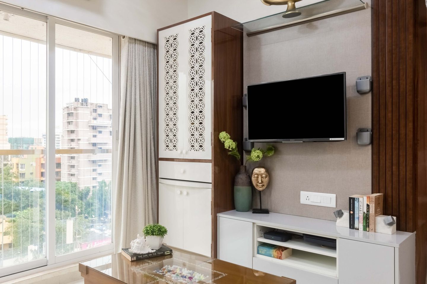 Frosty White TV Unit Design With Fluted Wooden Panelling | Livspace