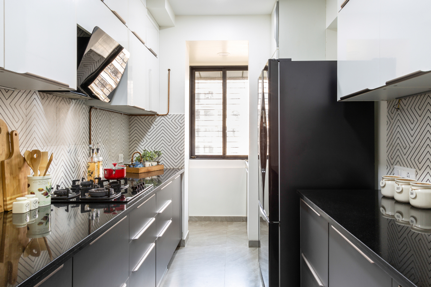 Parallel Kitchen Design With A Tall Storage Unit | Livspace