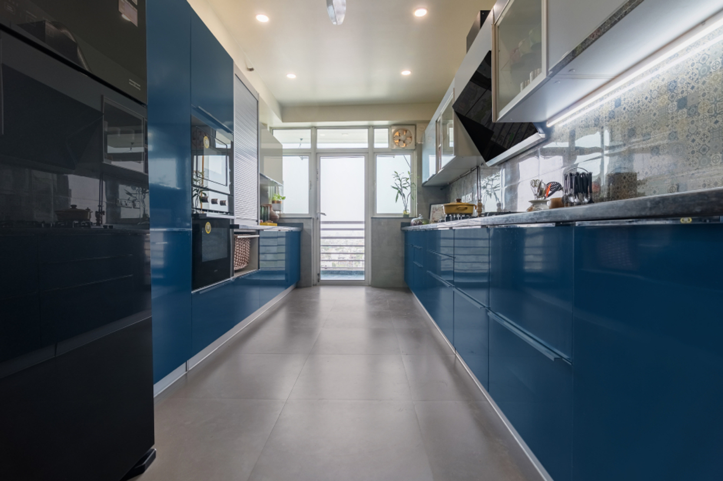 Parallel Kitchen Design With Mosaic Backsplash Tiles | Livspace