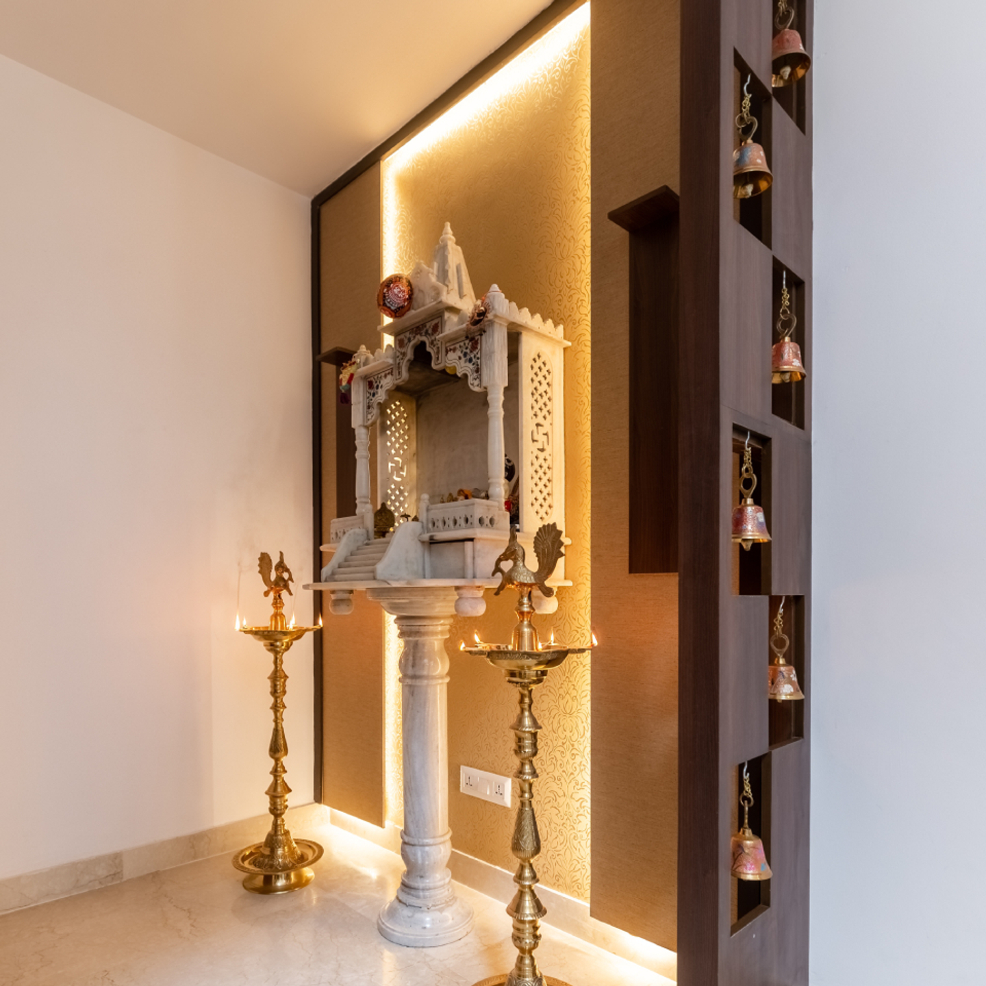 Compact Pooja Room Design With Warm-Toned Wall Panelling | Livspace