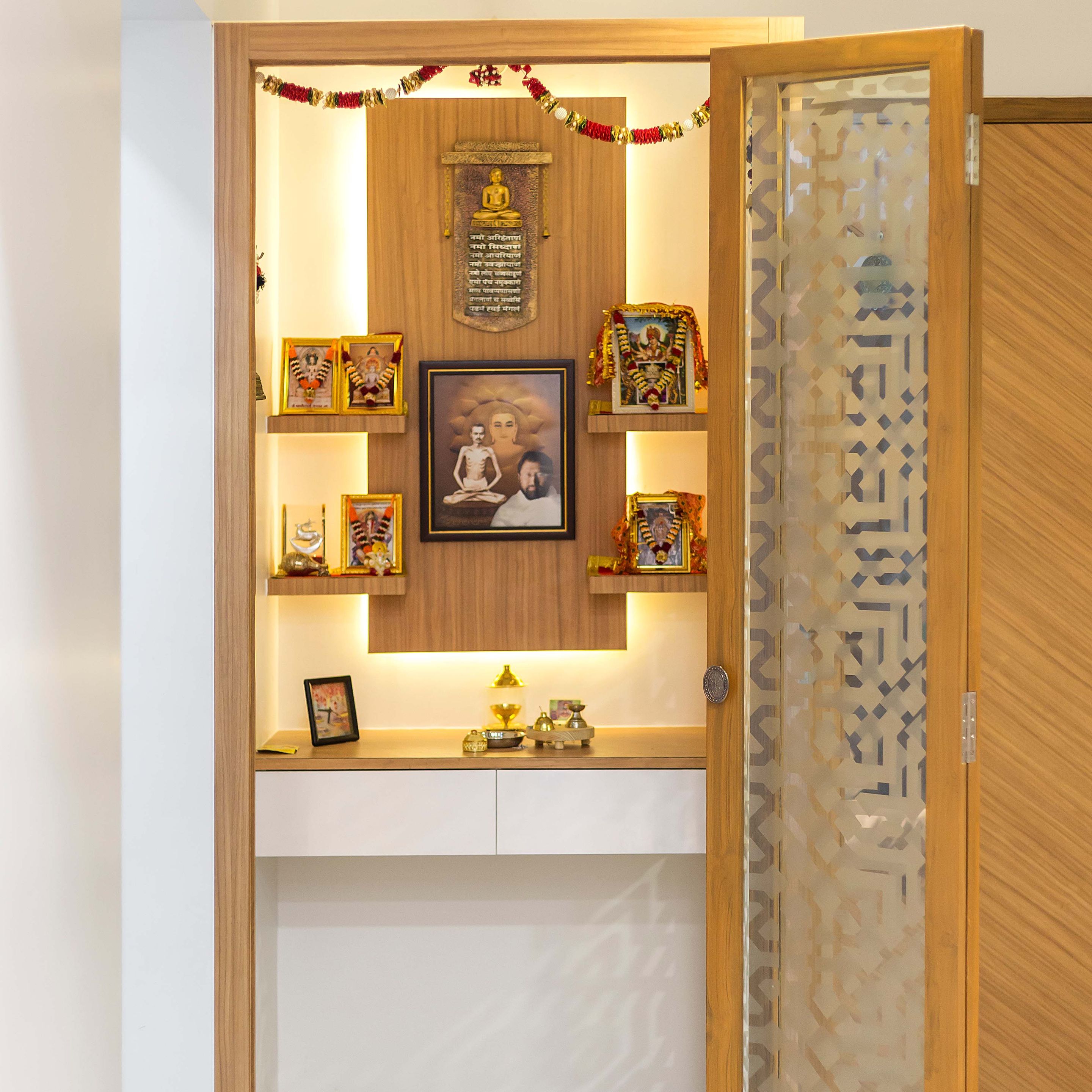 Modern Walnut Bronze And Frosty White Pooja Unit Design With Bi-Fold ...