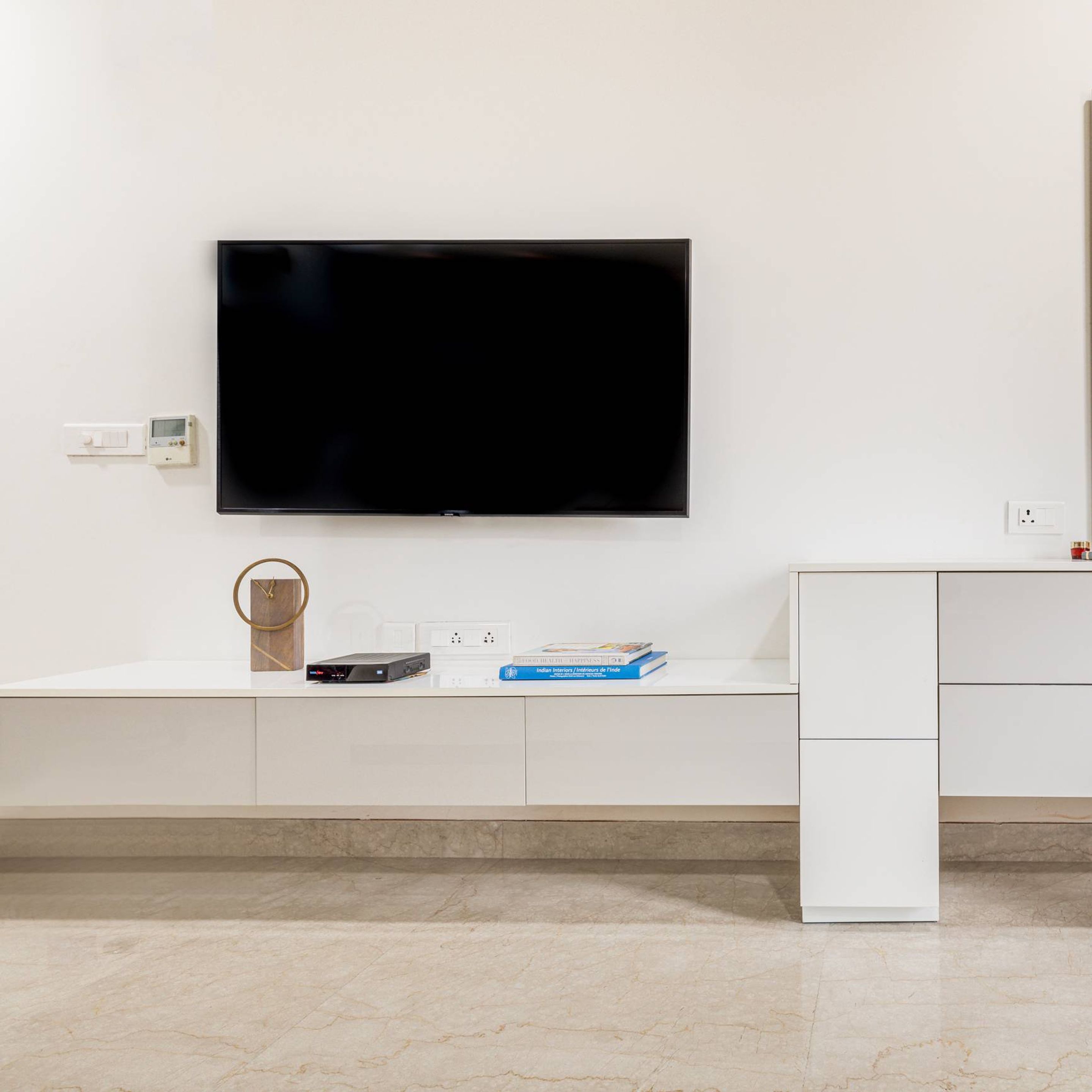 White TV Cabinet Design With A Laminated Finish | Livspace