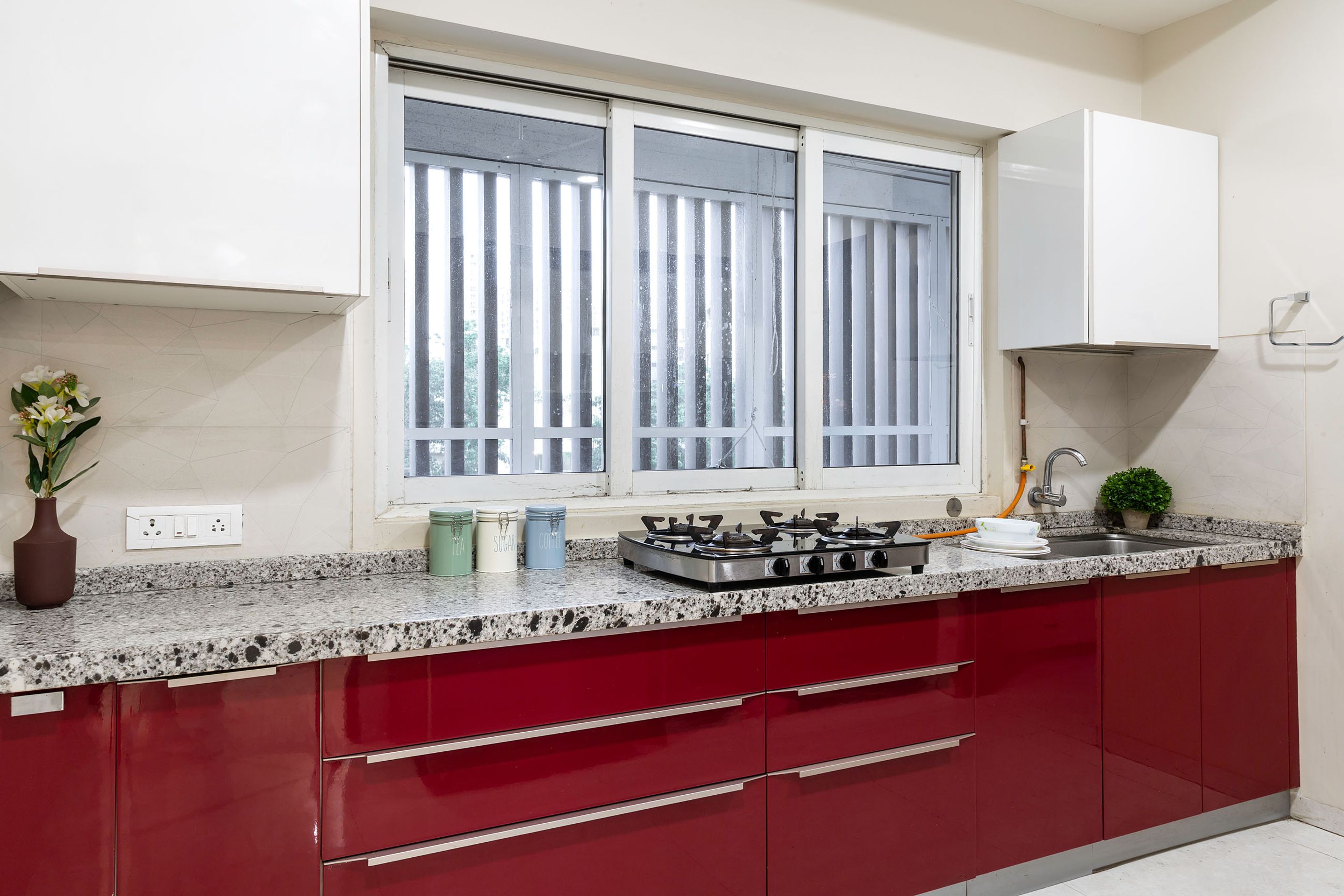 Fire Red And White Modular Kitchen Design With High Gloss Finish | Livspace
