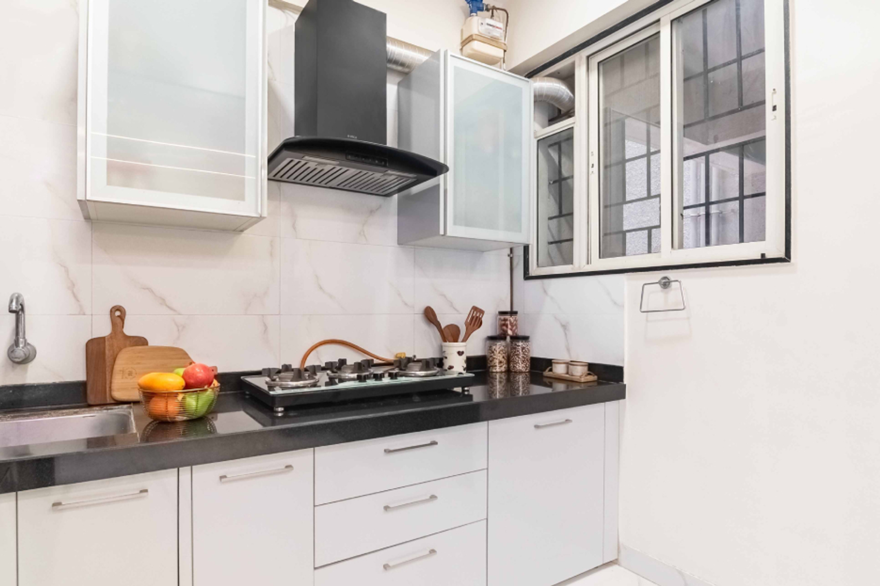 Kitchen Window Design With Black Granite Copping For The Sills | Livspace