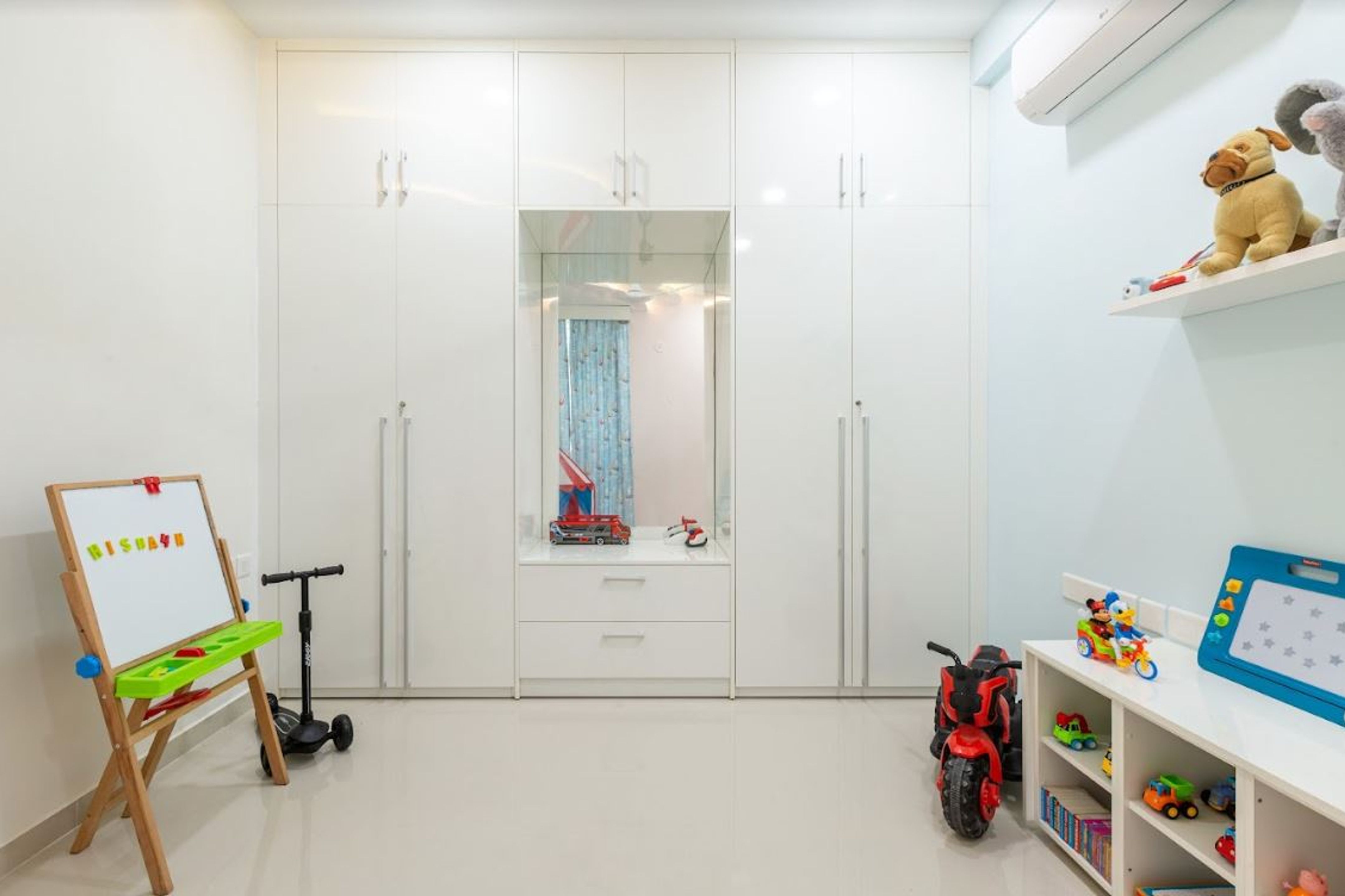 Compact Kids Room Design With White Wardrobe Design - 10x10 Ft | Livspace