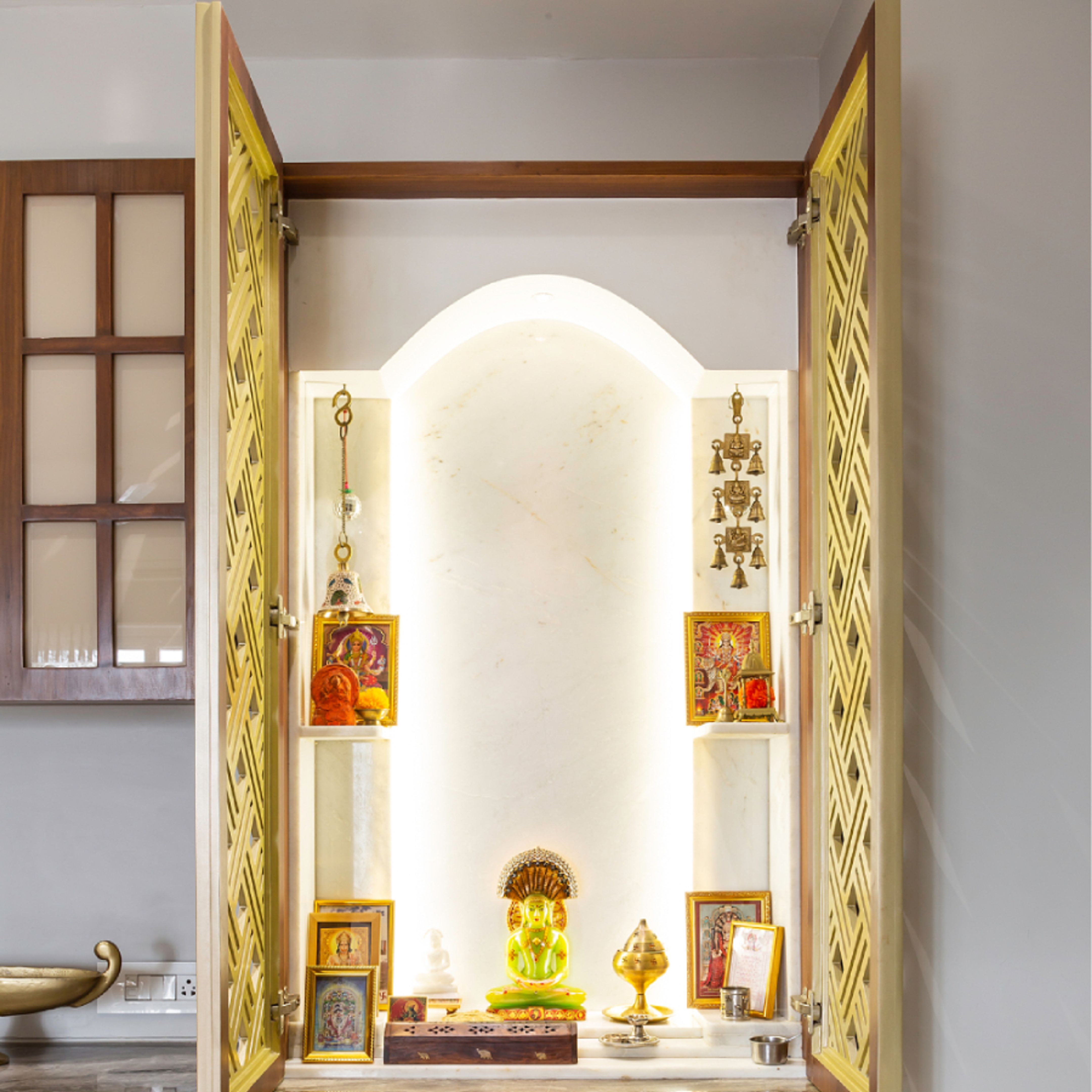 Compact Mandir Design With Frosty White Interiors | Livspace