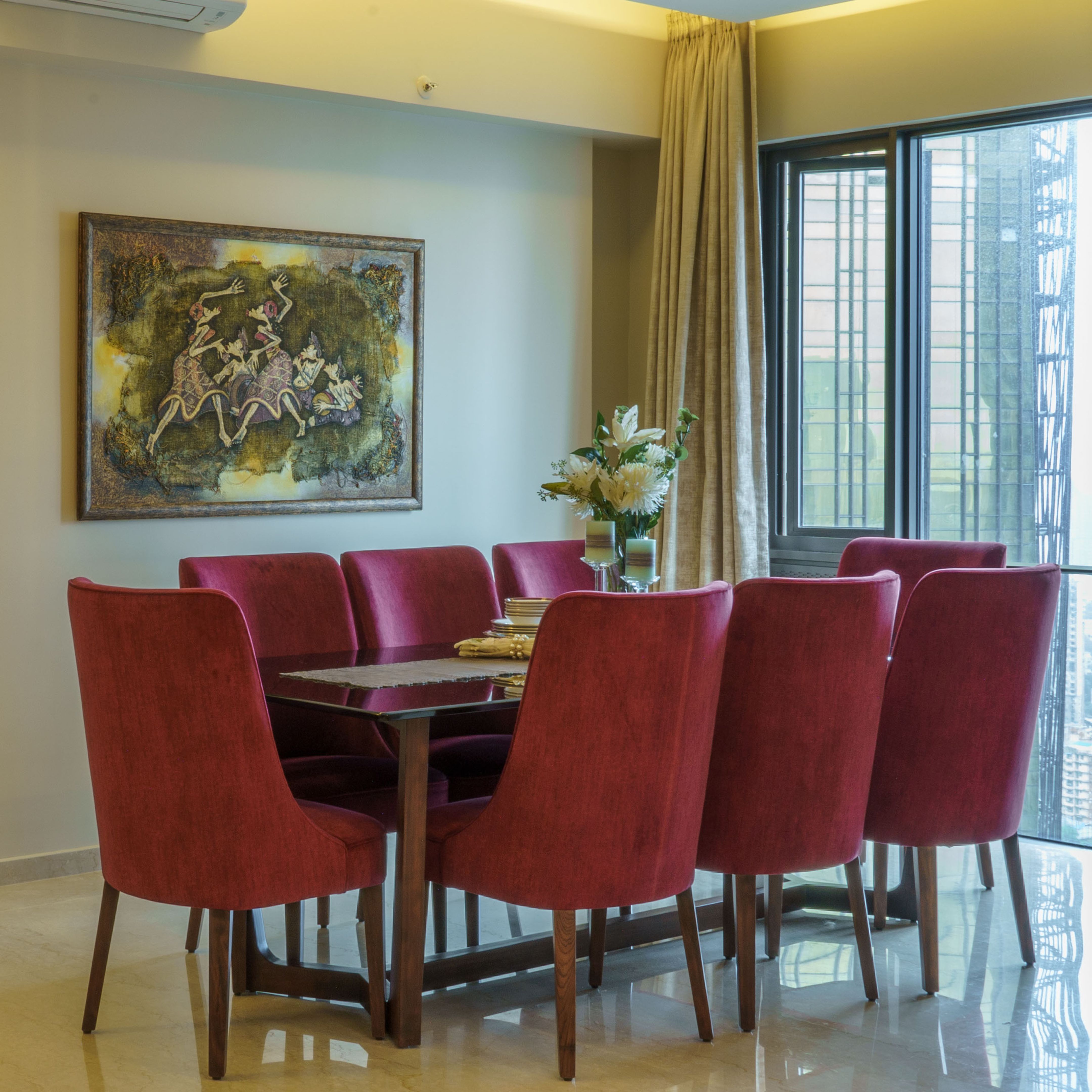 Spacious 8-Seater Dining Room Design With Pink Upholstery | Livspace