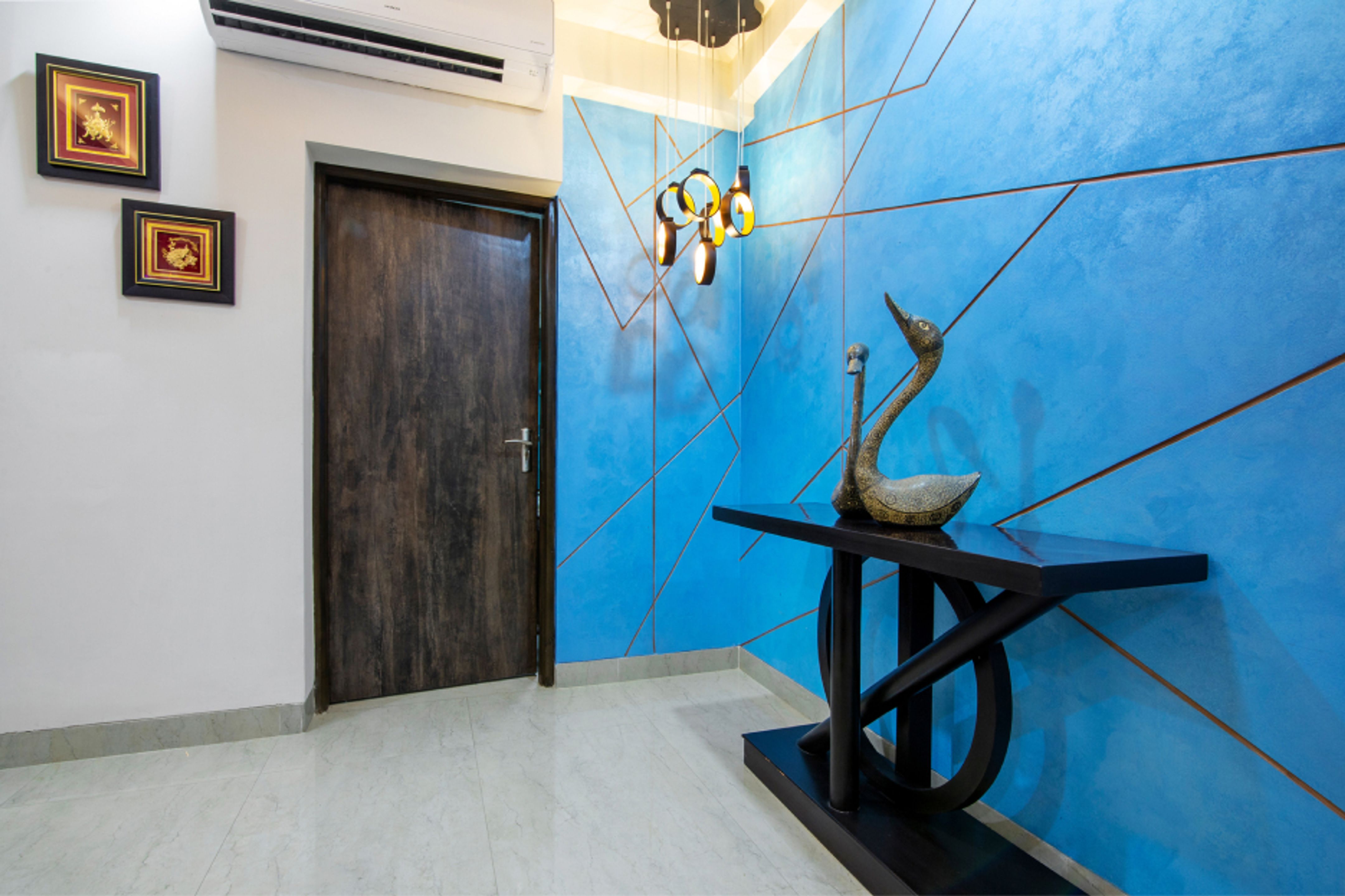 Spacious Foyer Design With Blue Accent Wall | Livspace