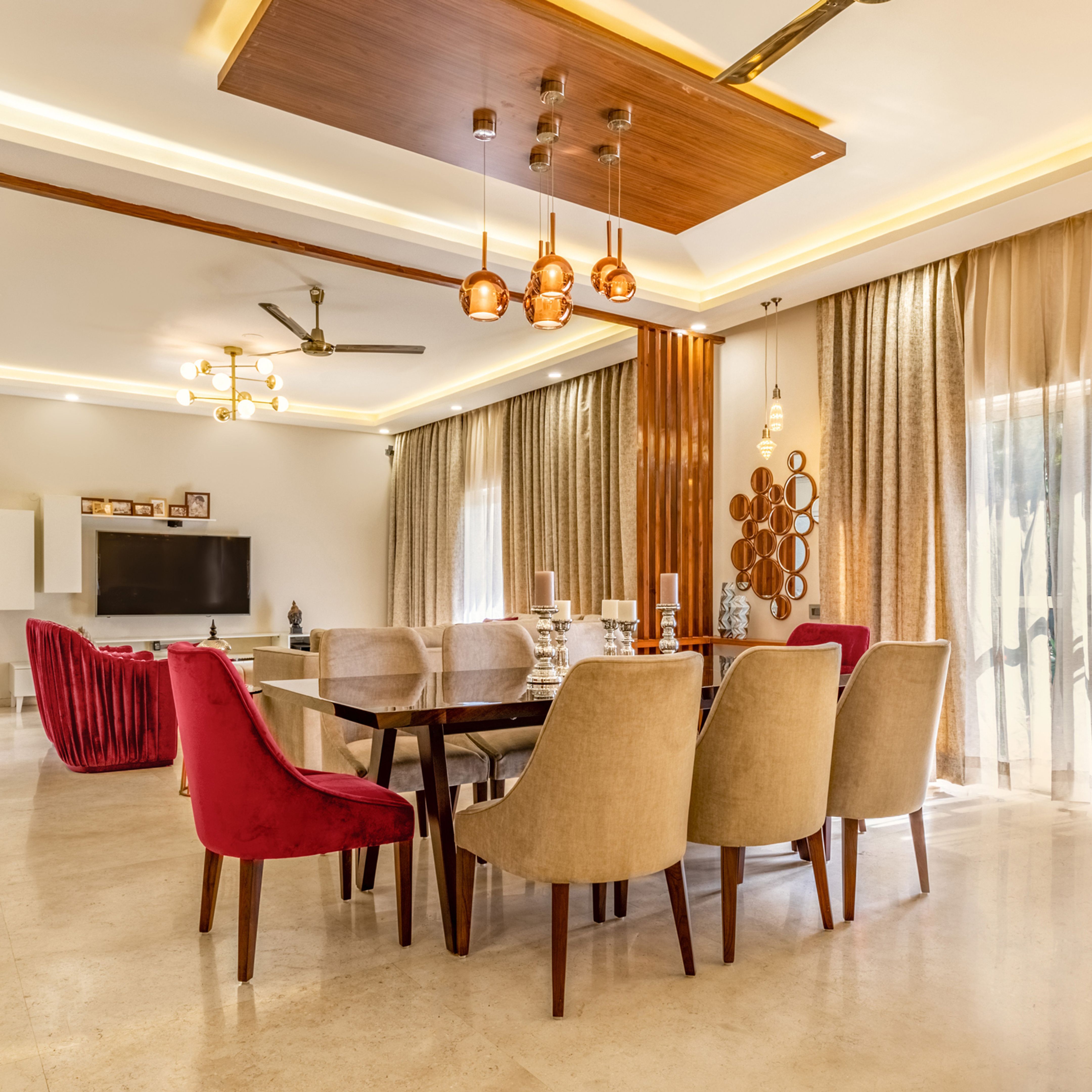Spacious Dining Room With Red Chairs | Livspace