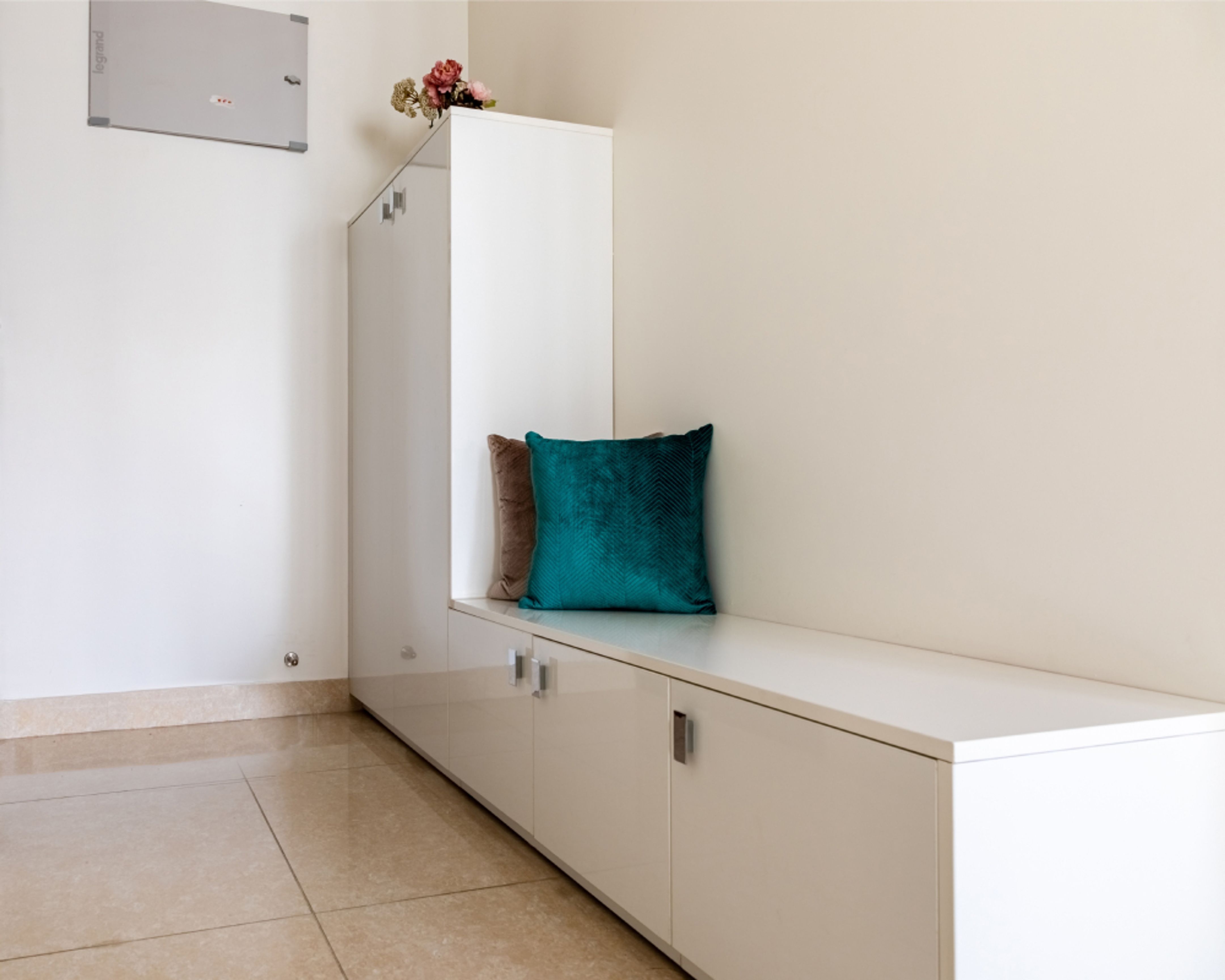 Spacious Foyer Design With Closed Storage | Livspace