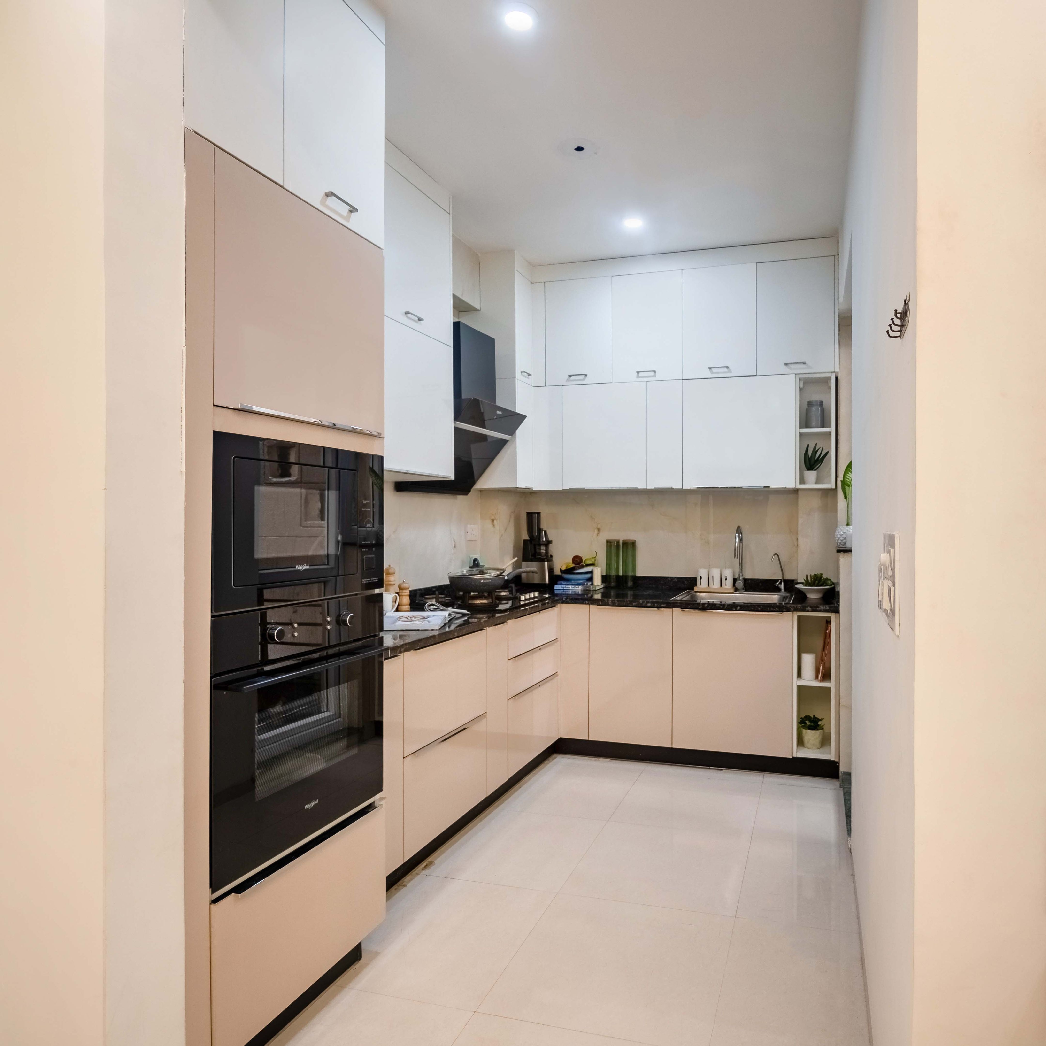 2-BHK Flat In Delhi With Beige And White L Shape Kitchen | Livspace