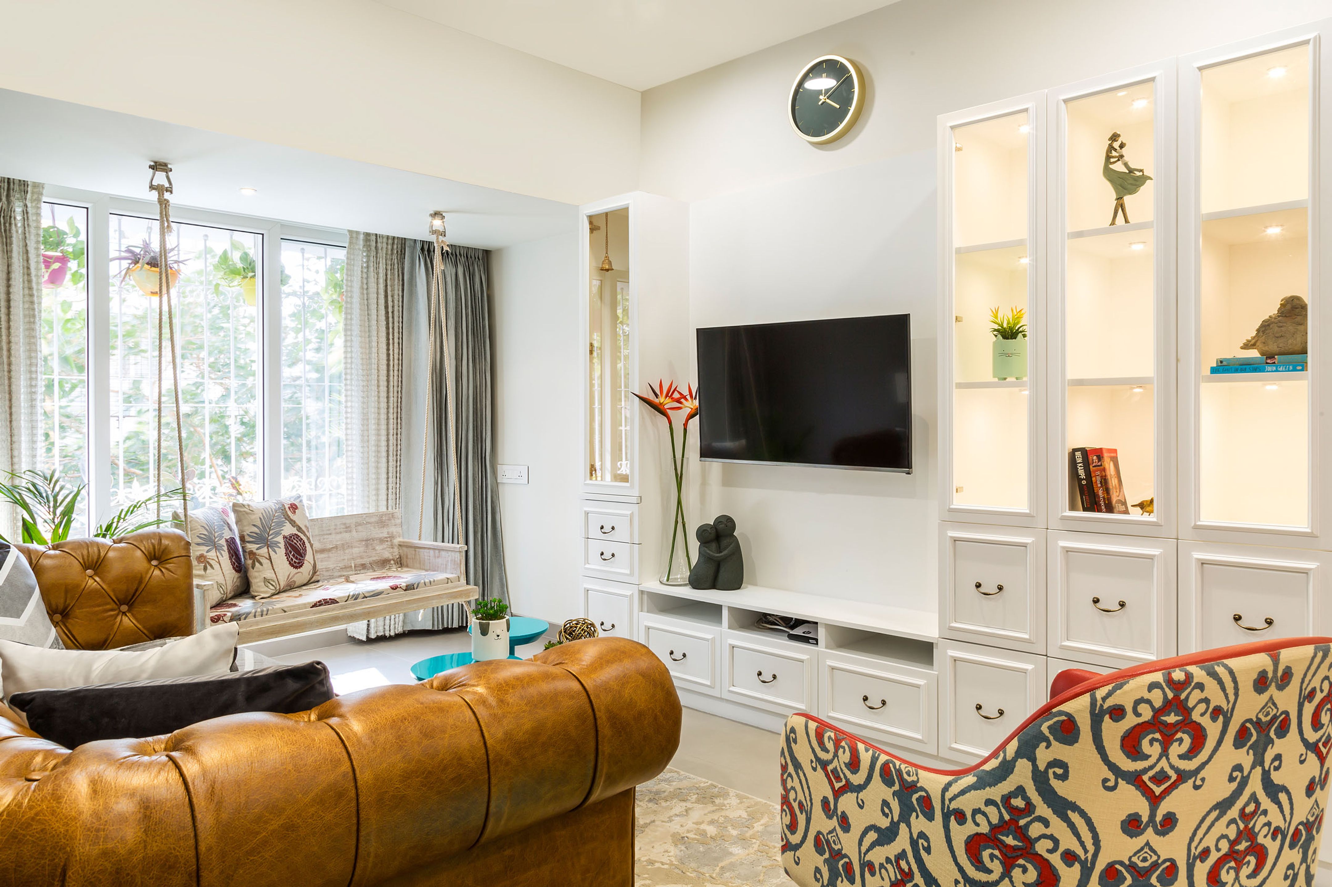 White Floor-Mounted TV Unit Design With Cabinet Lighting | Livspace White Floor-Mounted TV Unit Design With Cabinet Lighting | Livspace