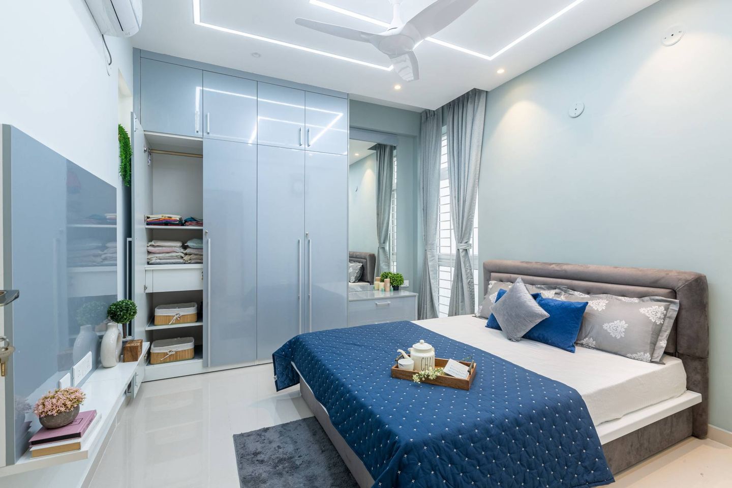 Spacious Guest Room Design With Sky Blue Wall | Livspace